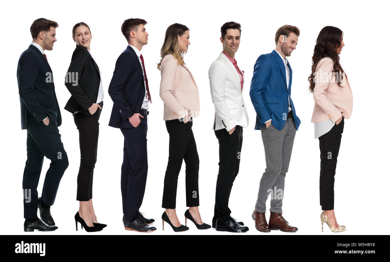 young happy business people standing and waiting in line on white ...