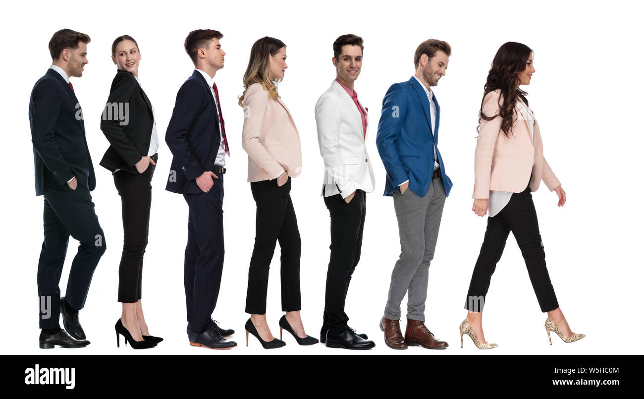 young businesswoman walking out from a line of people on white ...