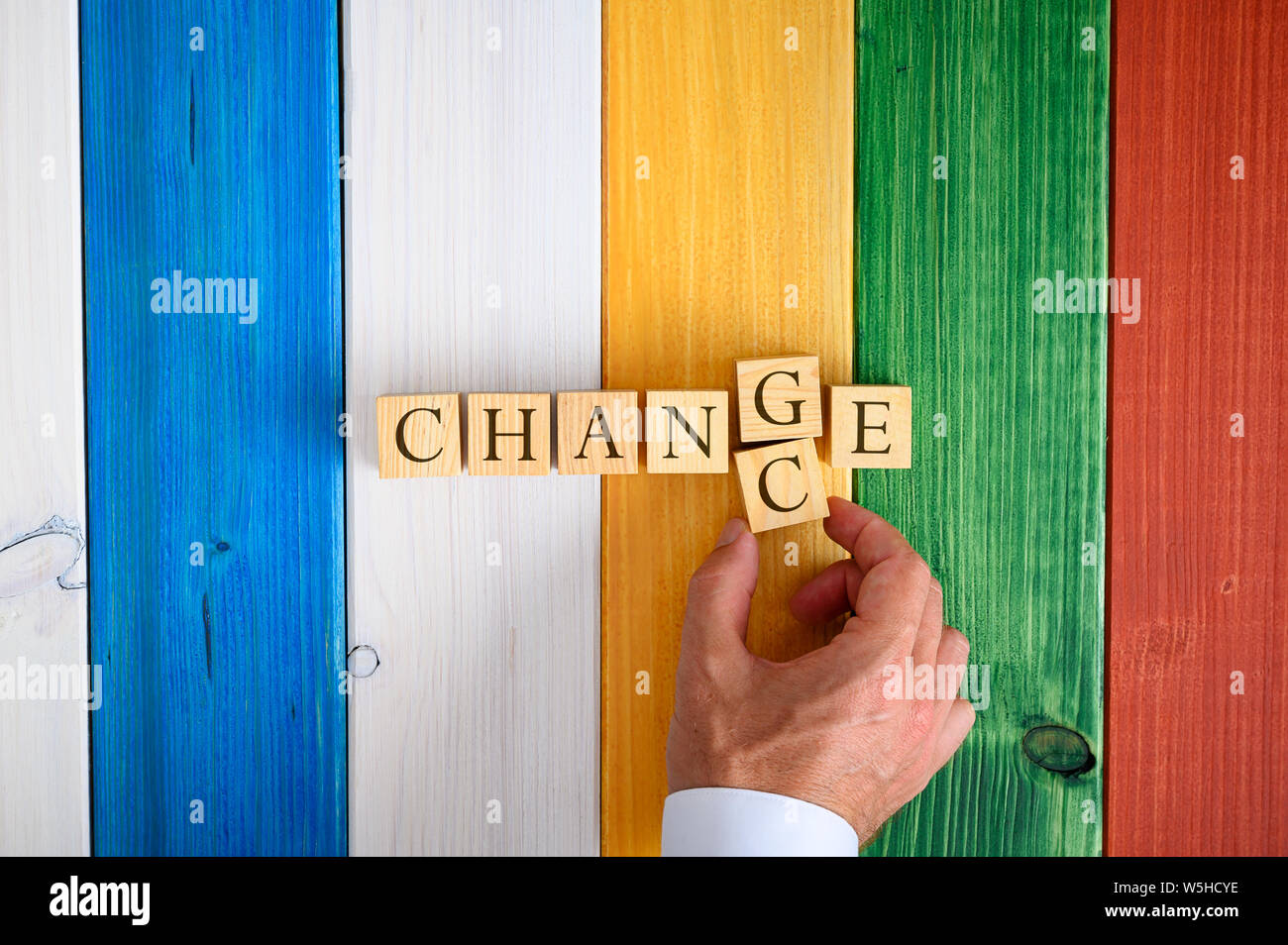 Male hand changing the word Change in to Chance by switching letters G ...