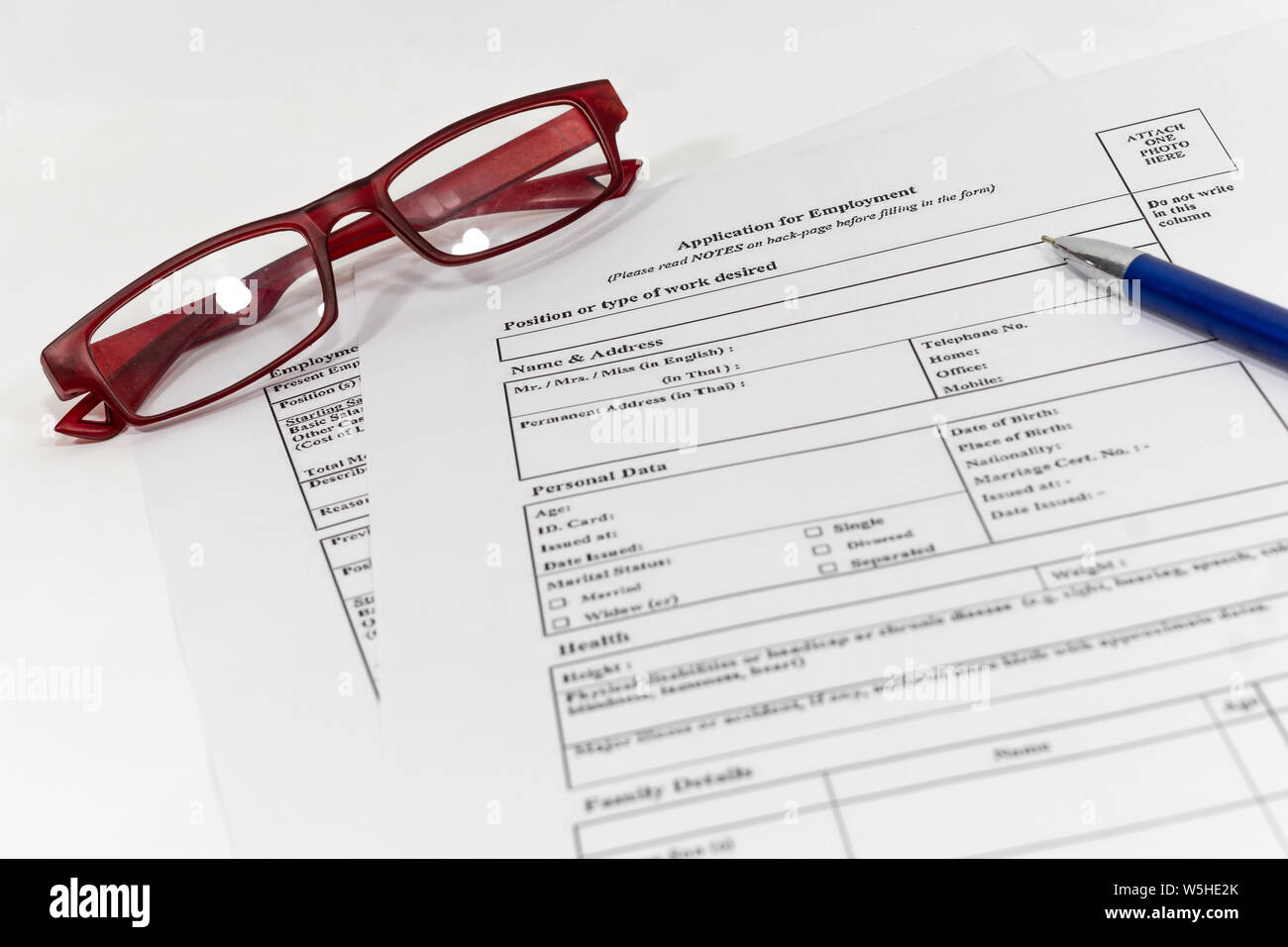 Pen and glasses placed on the job application document, Application ...