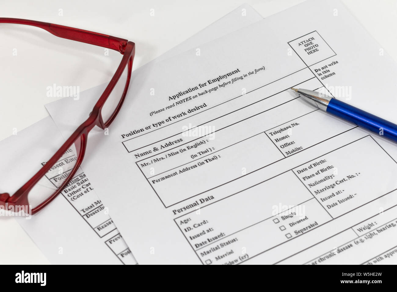 Pen and glasses placed on the job application document, Application ...