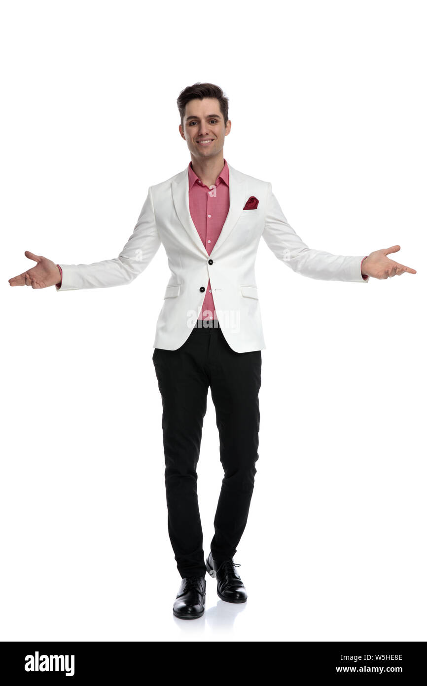 smiling modern man welcoming on white background Stock Photo - Alamy