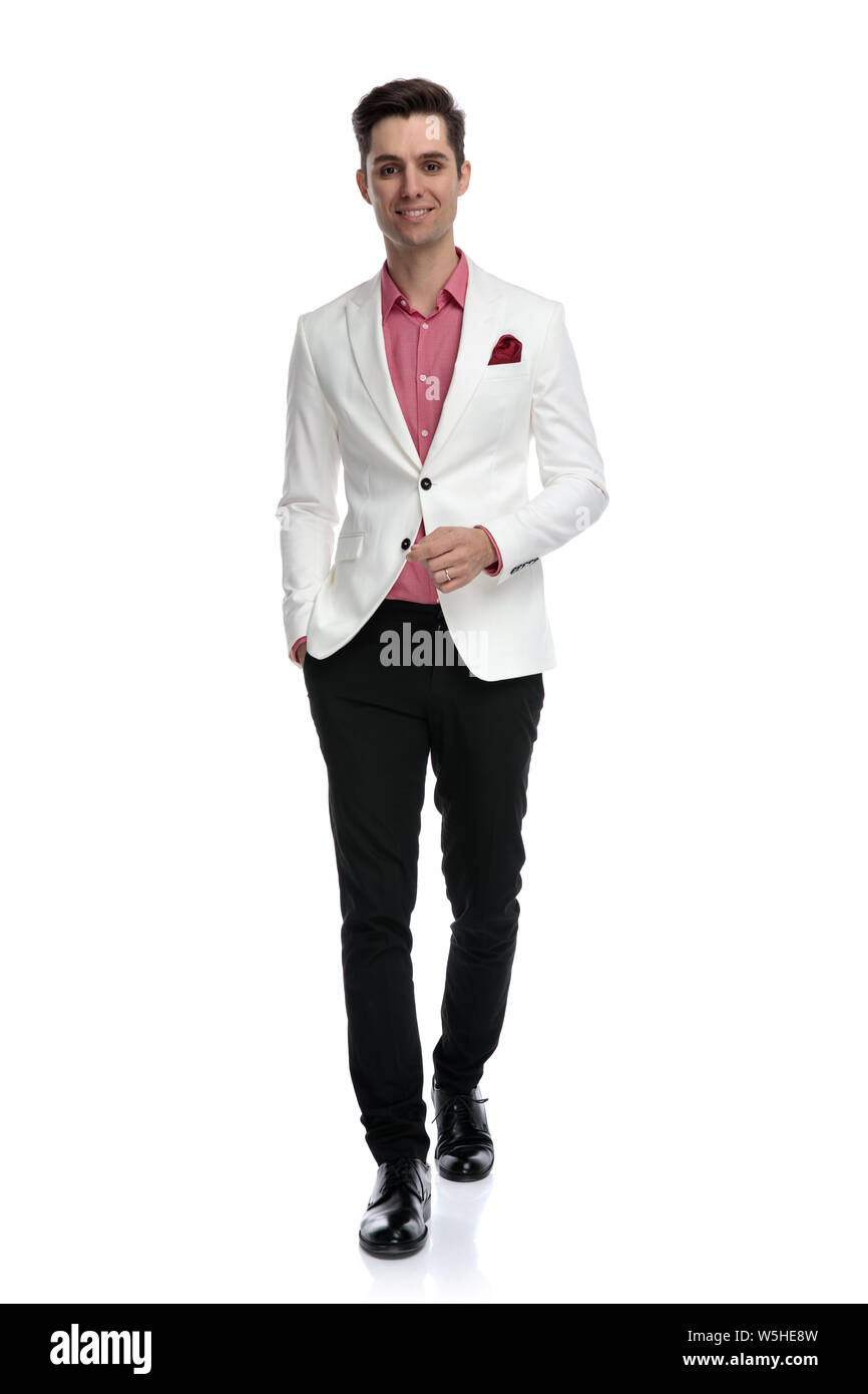 Walking with one hand in pocket hi-res stock photography and images - Alamy