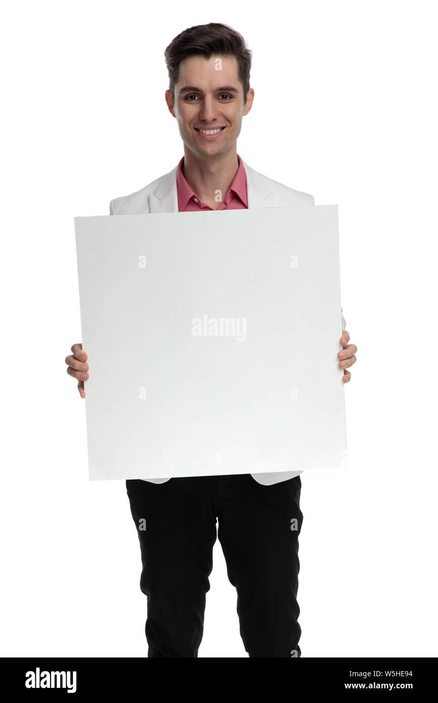 portrait of a young elegant man presenting a blank message board on ...