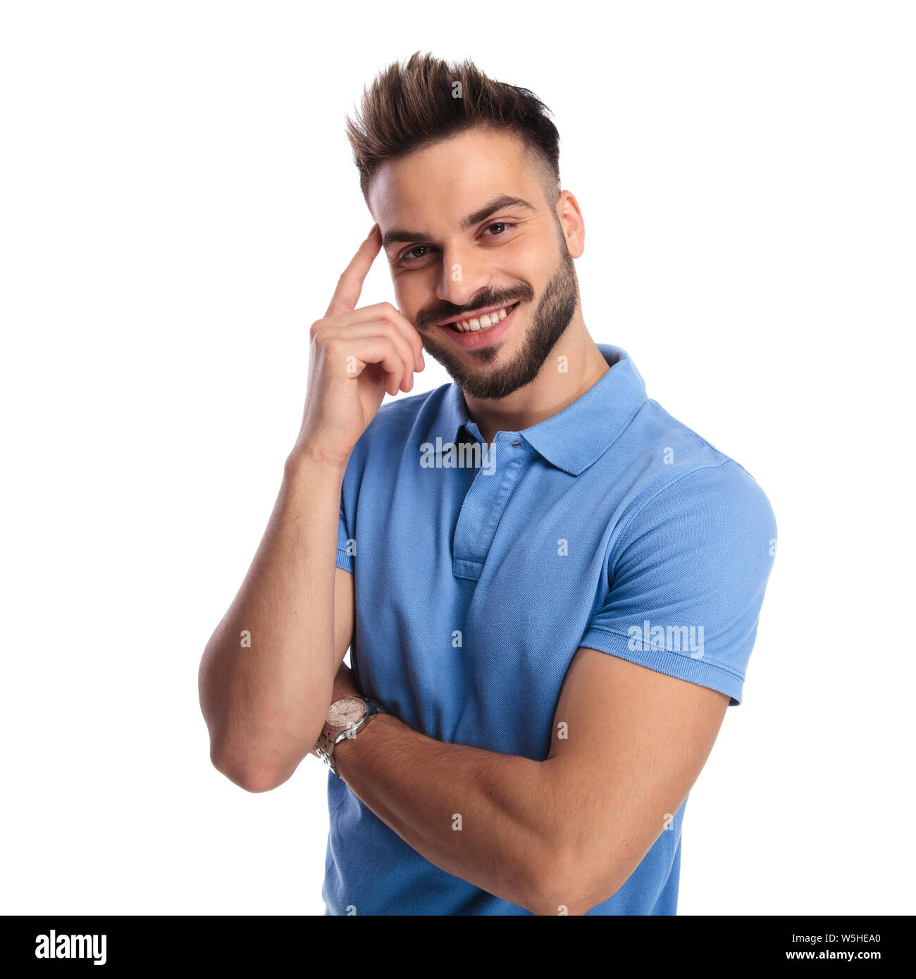 Portrait of a ygood-looking, well-dressed man wearing a blue polo ...