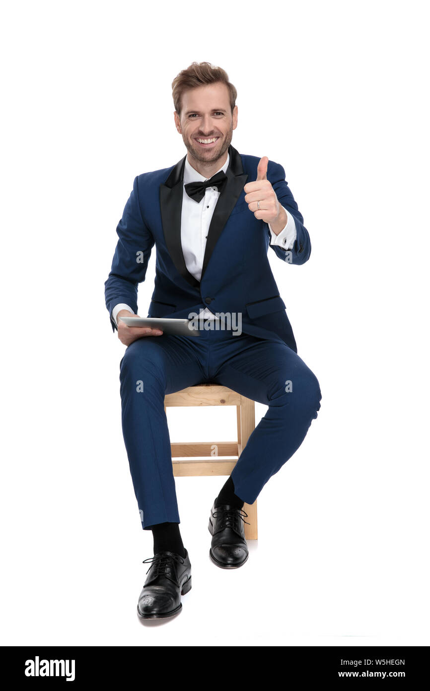Happy tuxedo man hold Cut Out Stock Images & Pictures - Alamy
