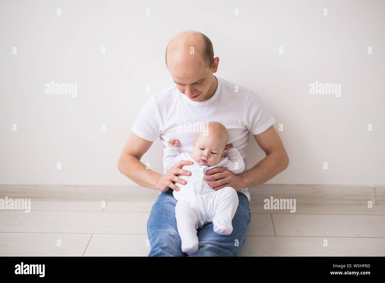 Children, family and fatherhood concept - happy bald father holding ...