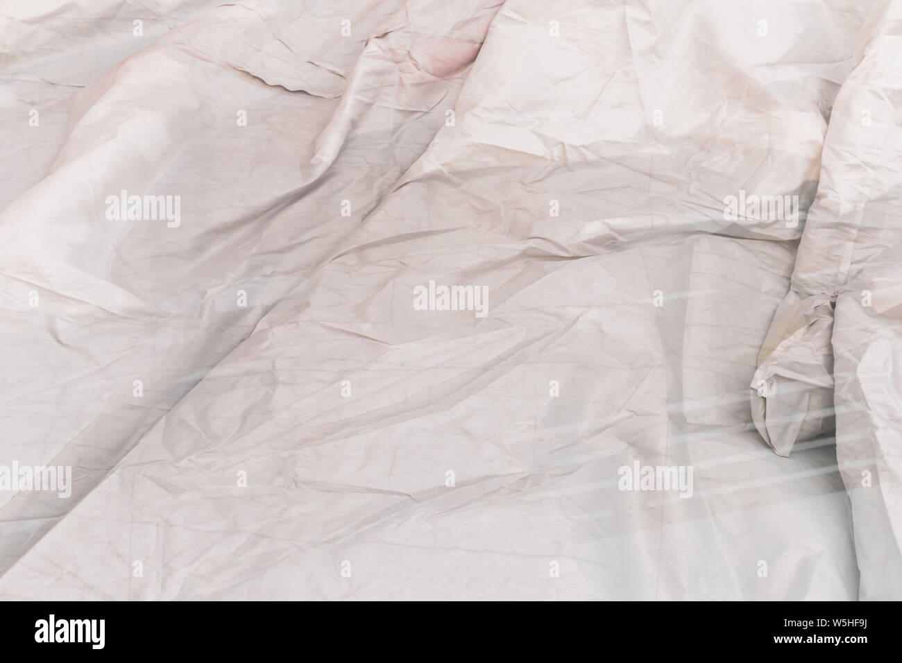 Wrinkled gray canvas that is in the water. Fabric crease background and ...