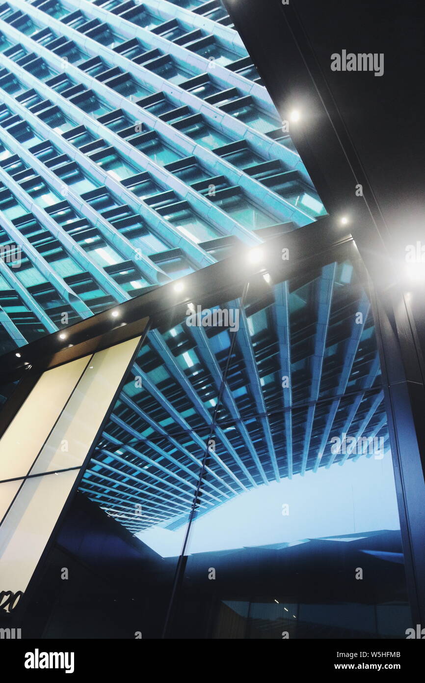 A large screen displaying landscape videos at the ceiling of a passage ...