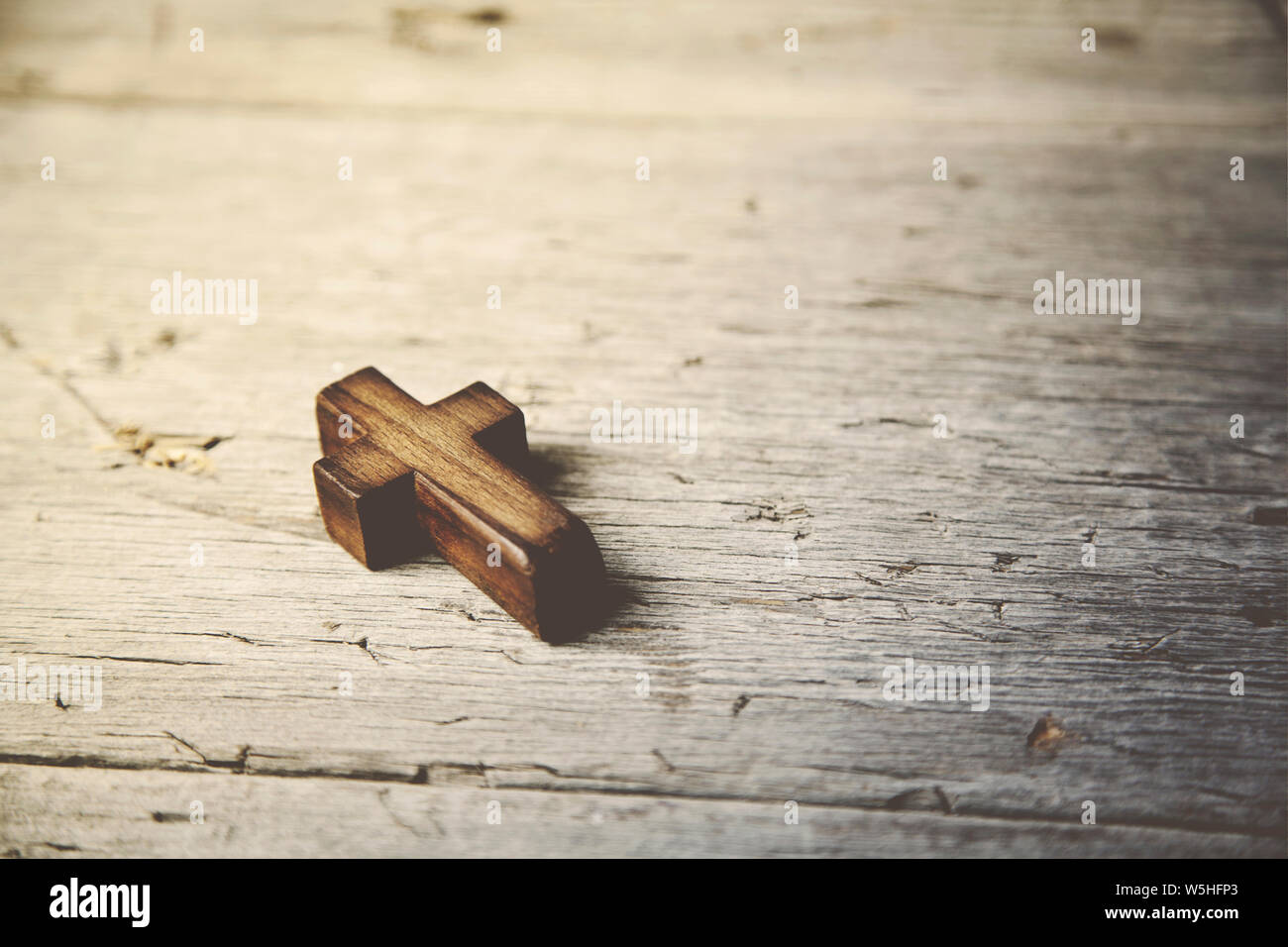 Crosses on a wooden table background Stock Photo - Alamy