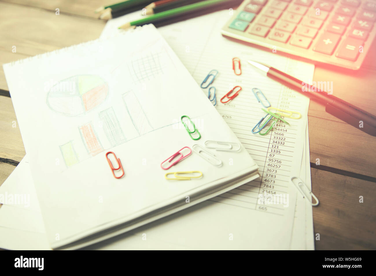 stationery objects on wood table with open notebook Stock Photo - Alamy