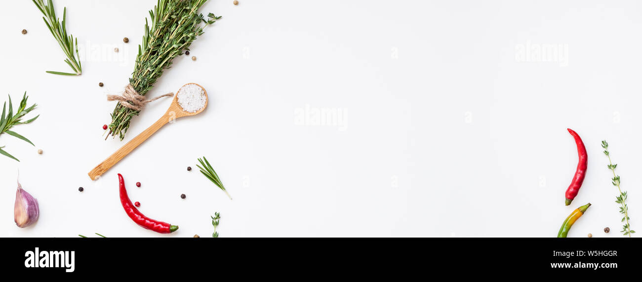 Flat lay overhead top view of greens herbs and spices on white ...