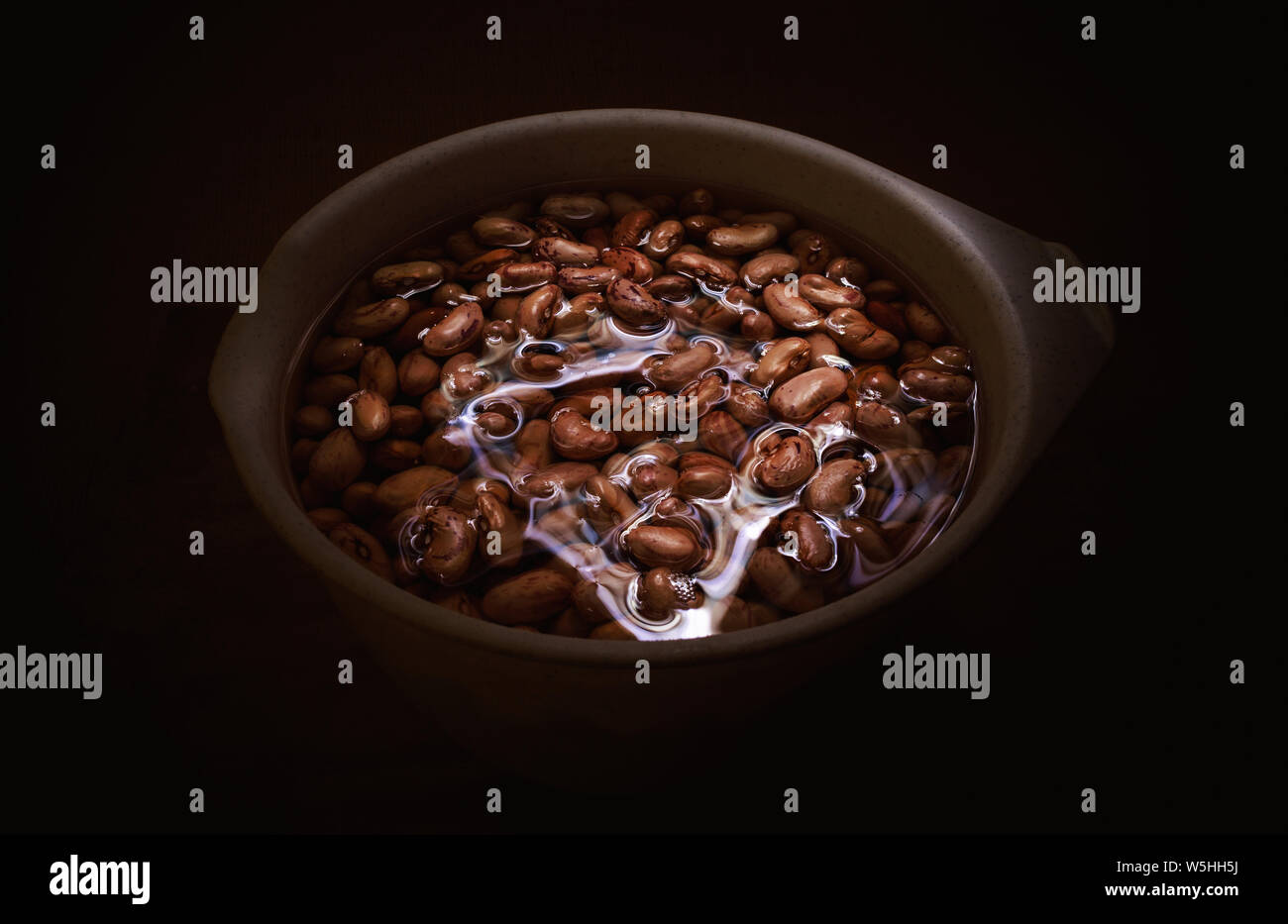 Preparing beans for cooking, details of beans in water Stock Photo - Alamy