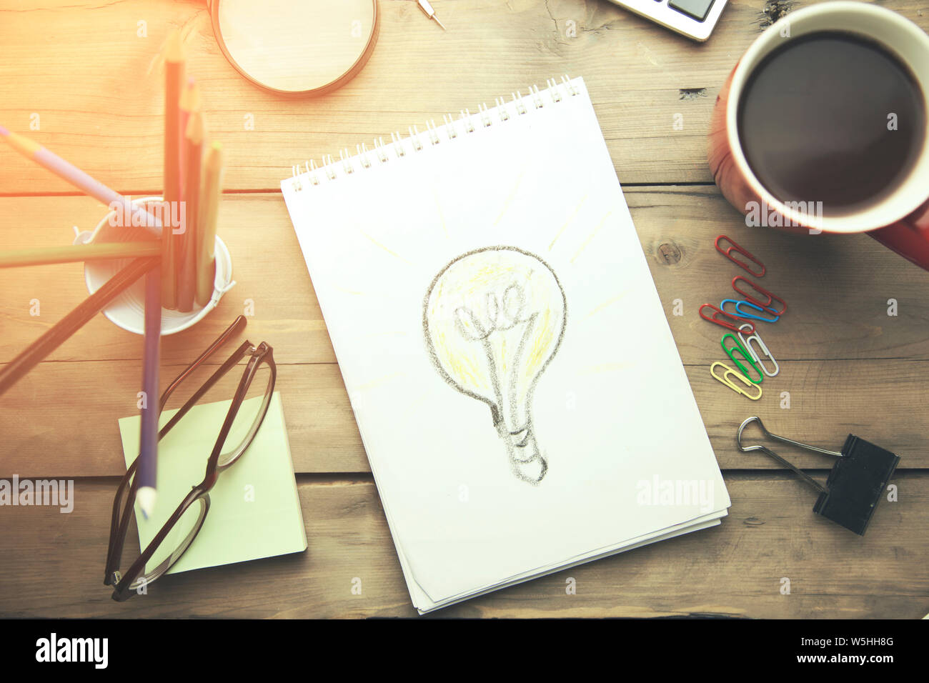 working wooden table on different office accessories Stock Photo - Alamy