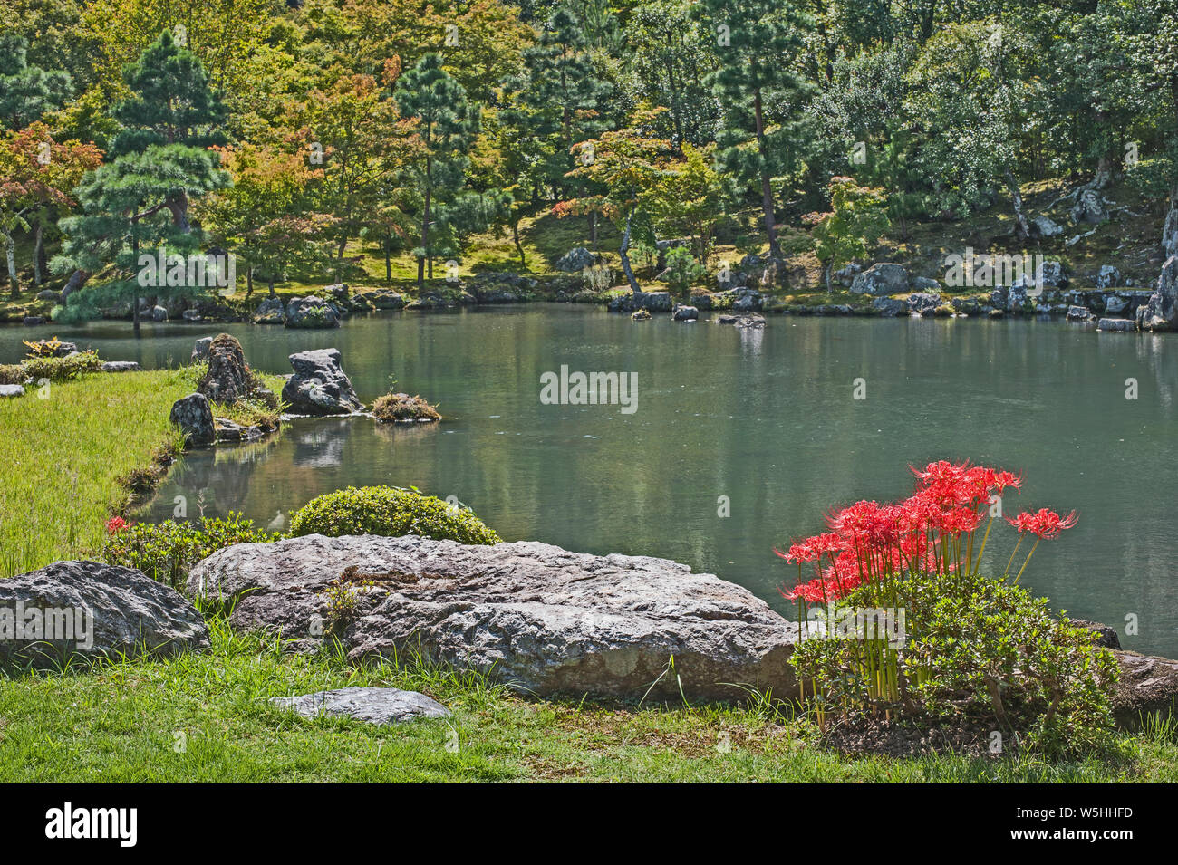 The Sogen ornamental pond featuring rocks, surrounded by trees at the ...