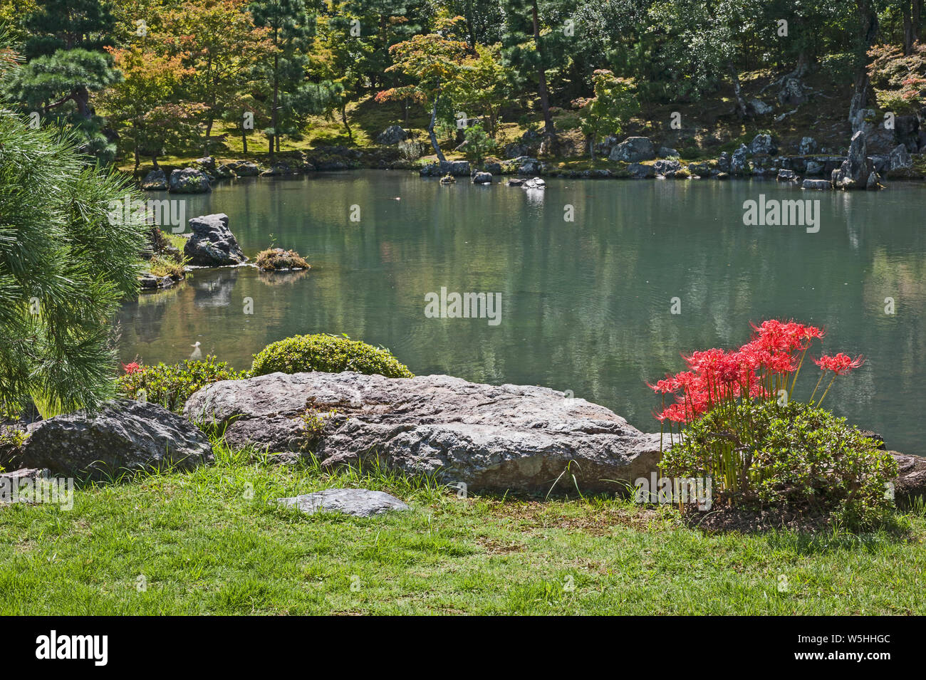 The Sogen ornamental pond featuring rocks, surrounded by trees at the ...