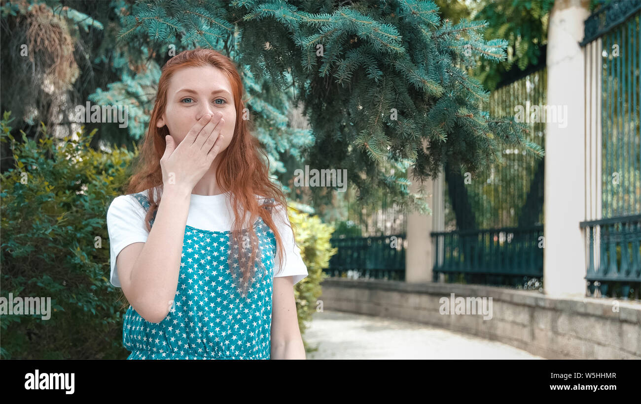 Smiling beautiful redhead woman covered mouth with laughter. Freckled ...