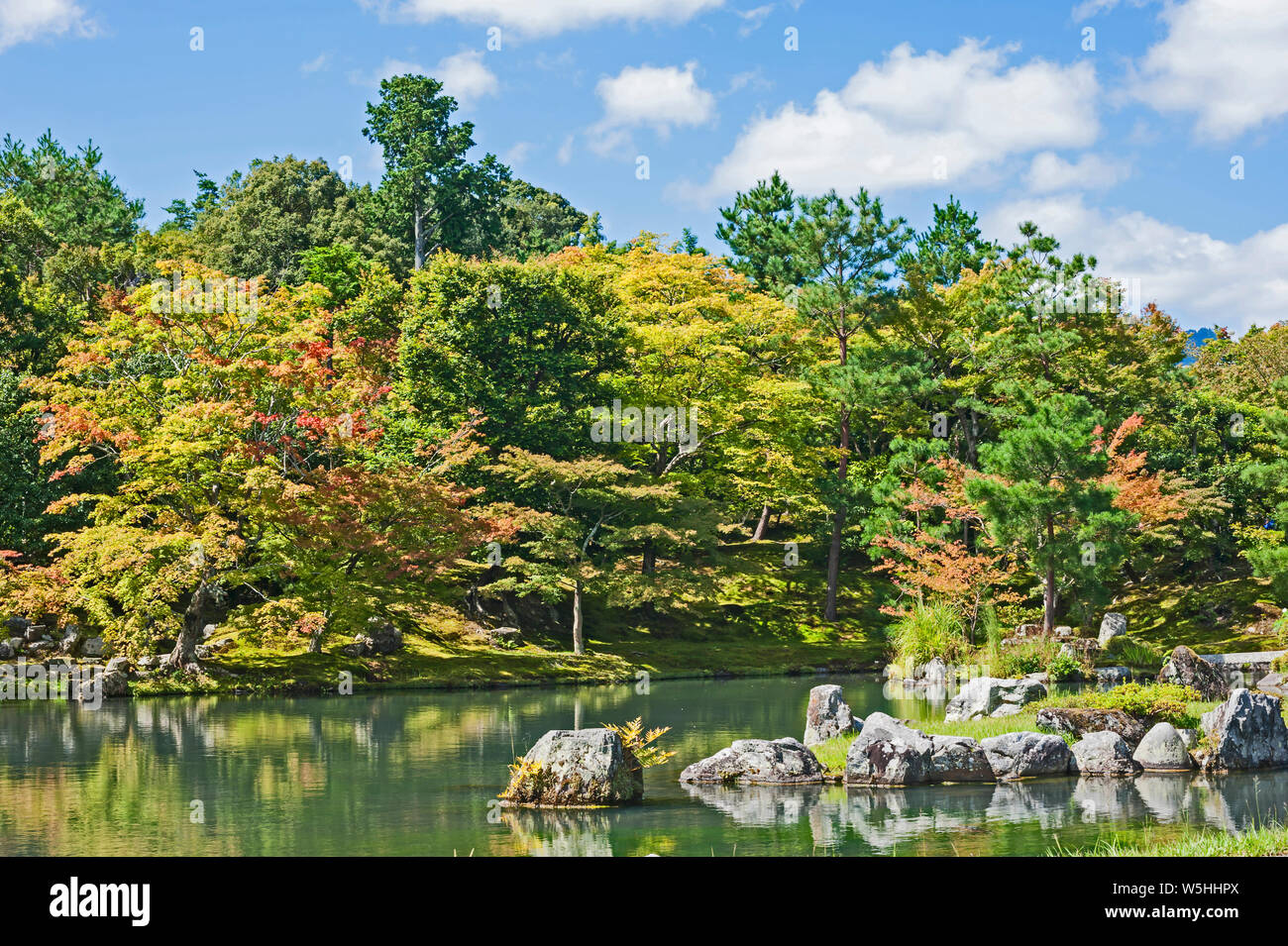 The Sogen ornamental pond featuring rocks, surrounded by trees at the ...