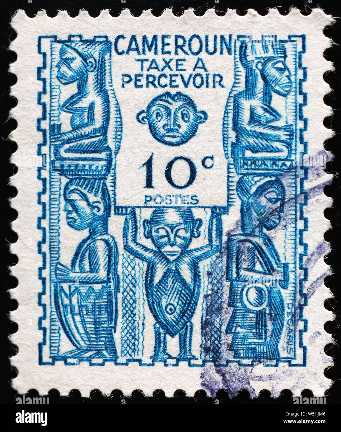 Wooden statuettes on vintage postage stamp of Cameroon Stock Photo - Alamy