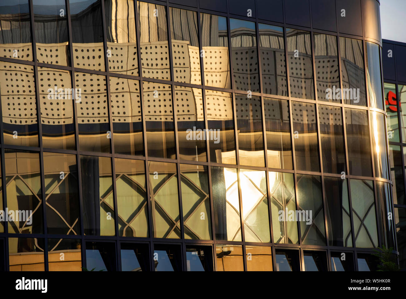 Dusk reflections in the windows of the Concert Hall in Nottingham City ...