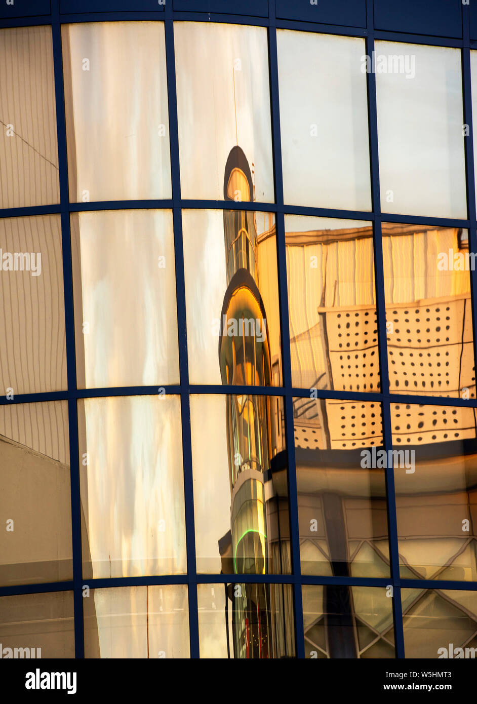Dusk reflections in the windows of the Concert Hall in Nottingham City ...