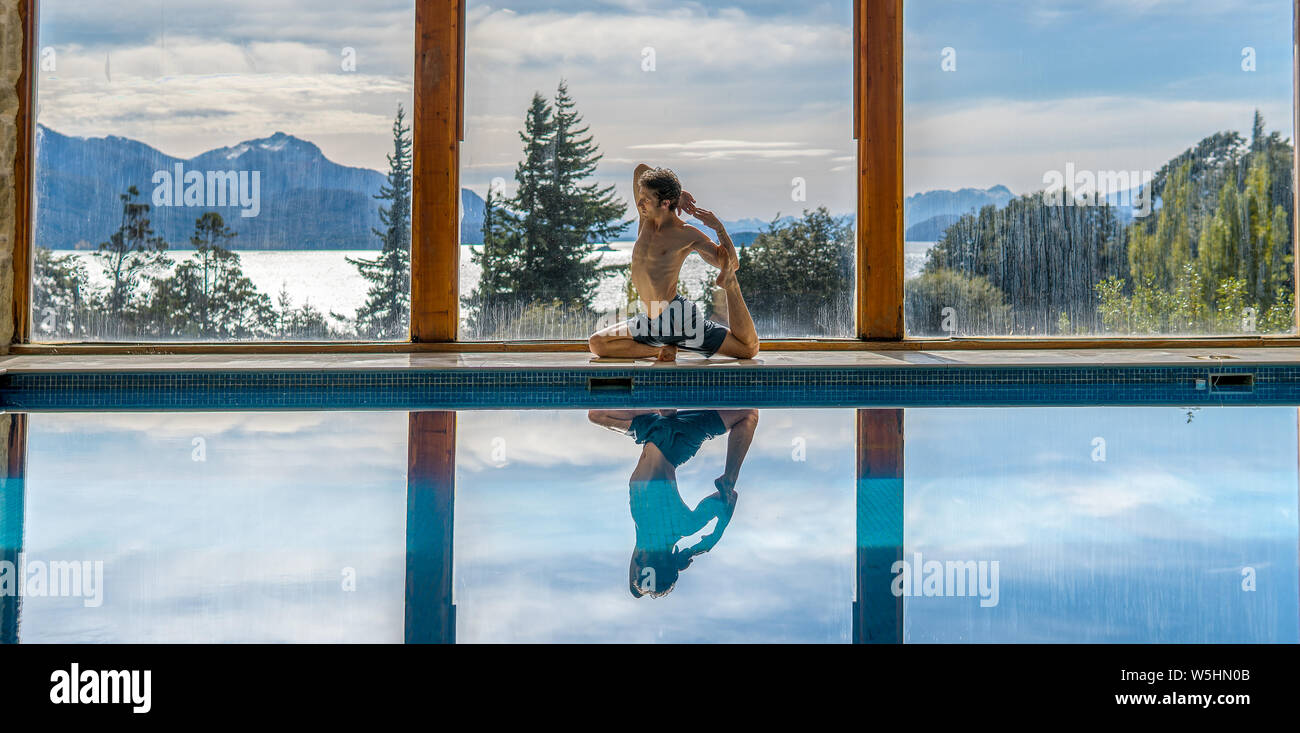 infront of mountains and lake with reflection in pool Stock Photo - Alamy