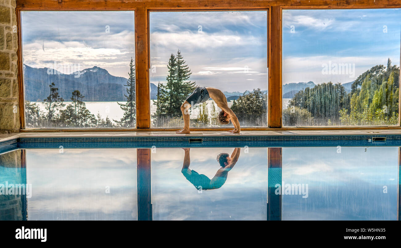 infront of mountains and lake with reflection in pool Stock Photo - Alamy