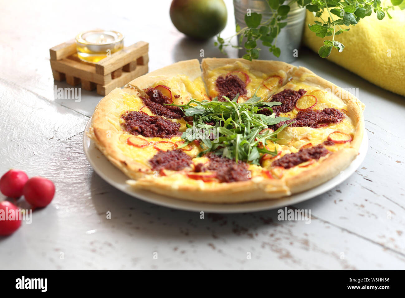Vegetarian pizza with vegetables, green arugula and tomato pulp ...