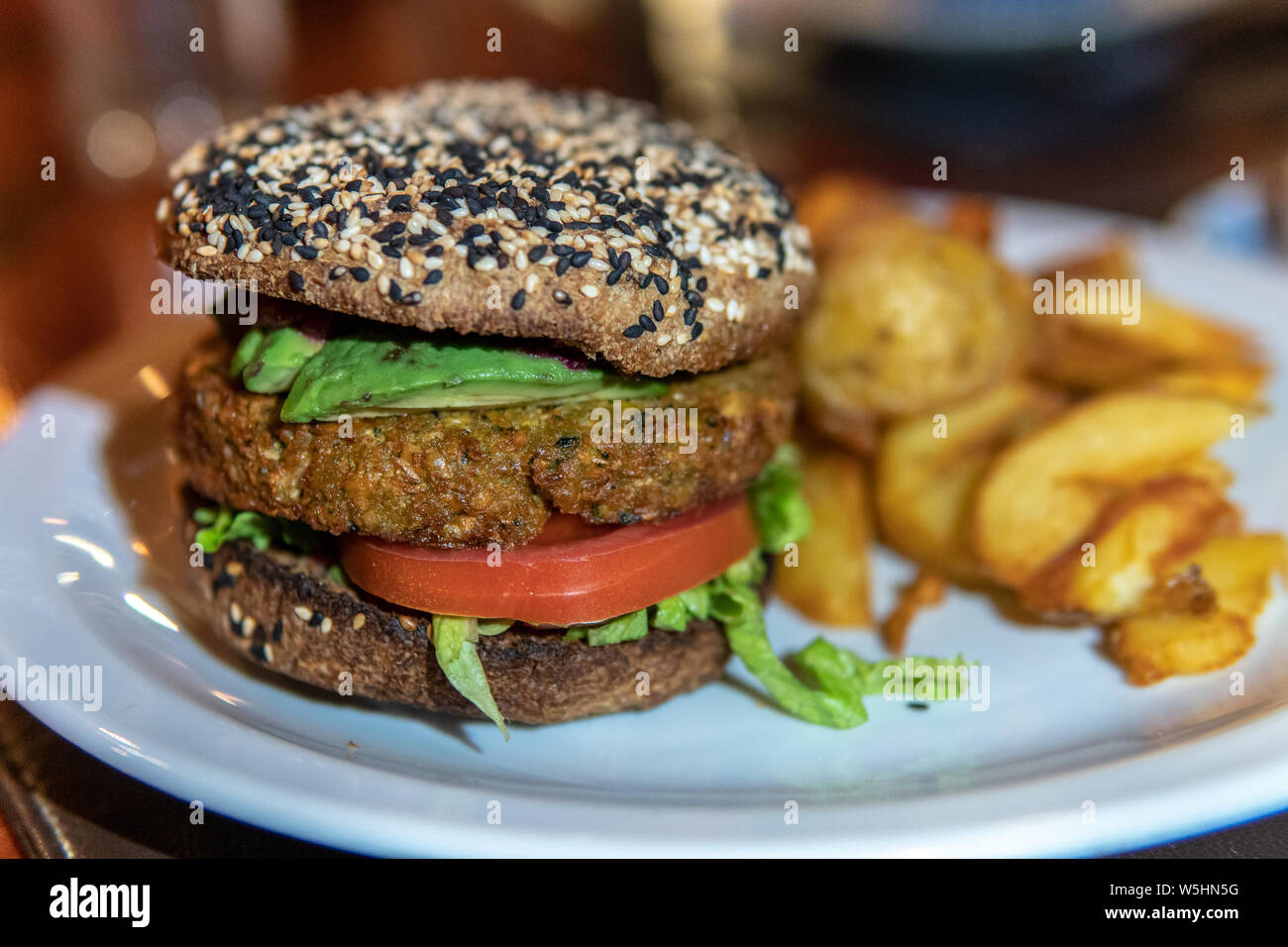 Healthy veggie burger with french fries on white plate for supper Stock ...