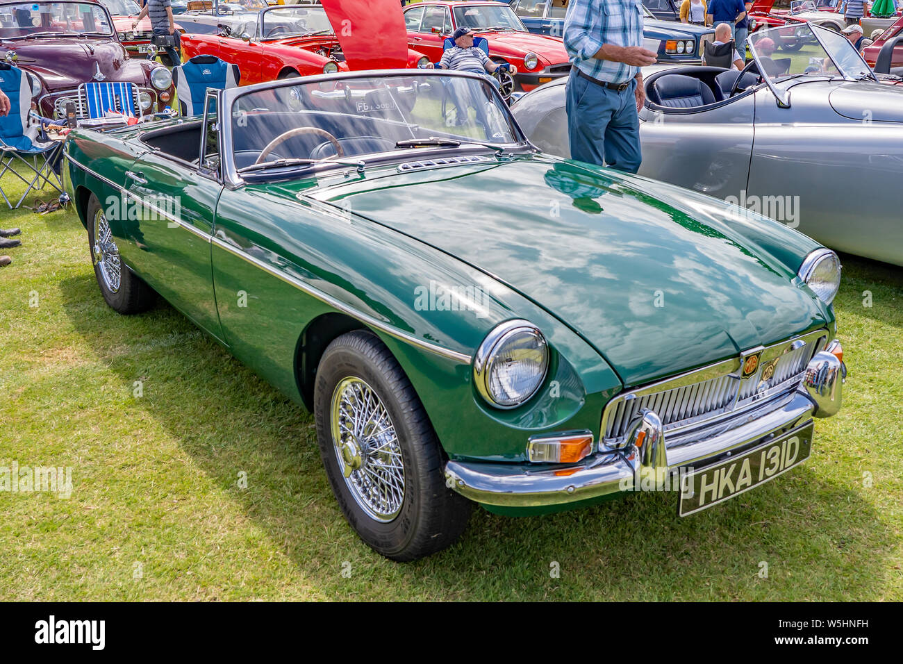 Front and side view of a classic MG Midget sports car on display at the ...