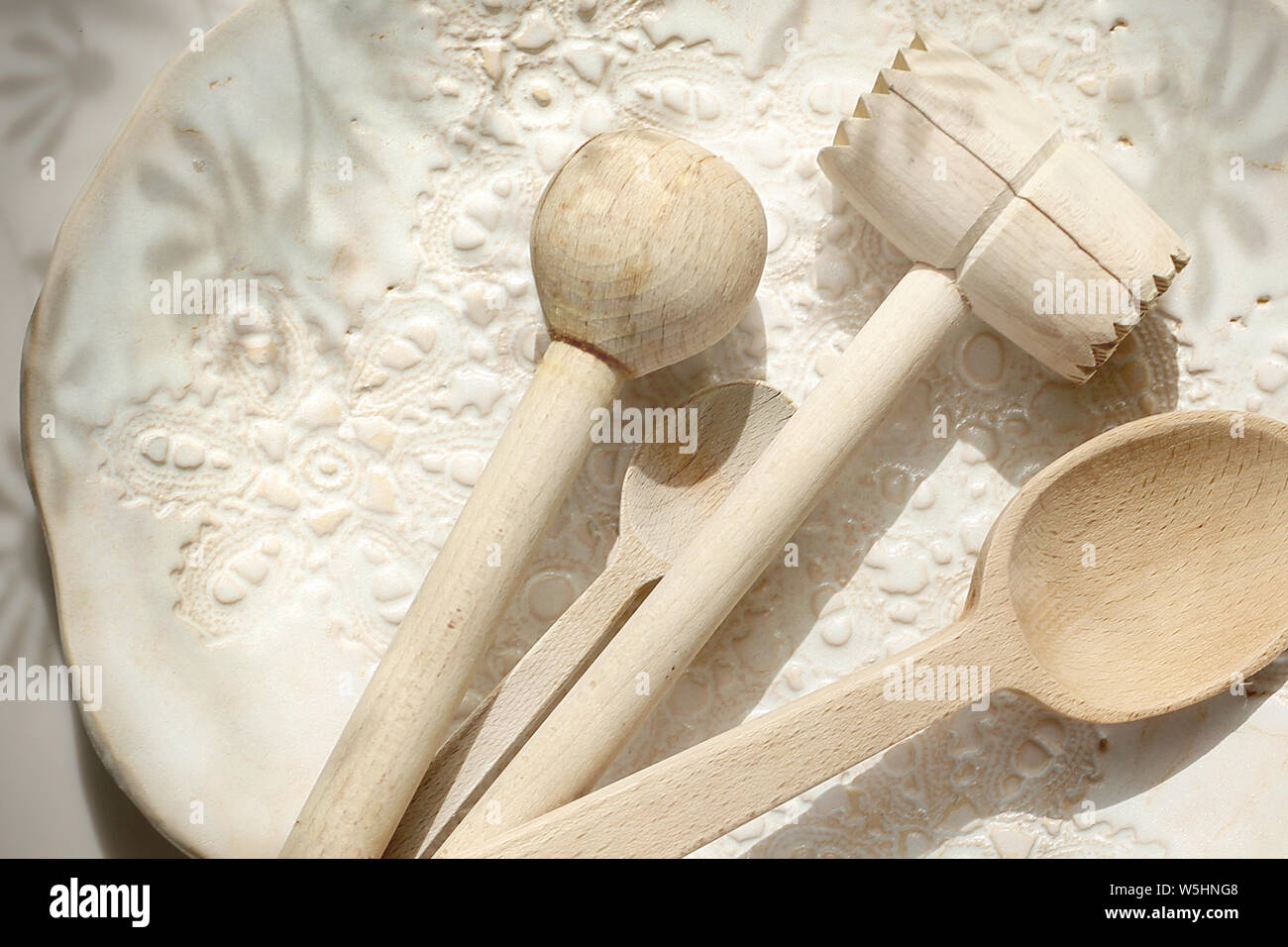 Natural vintage wooden kitchen accessories on a light background ...