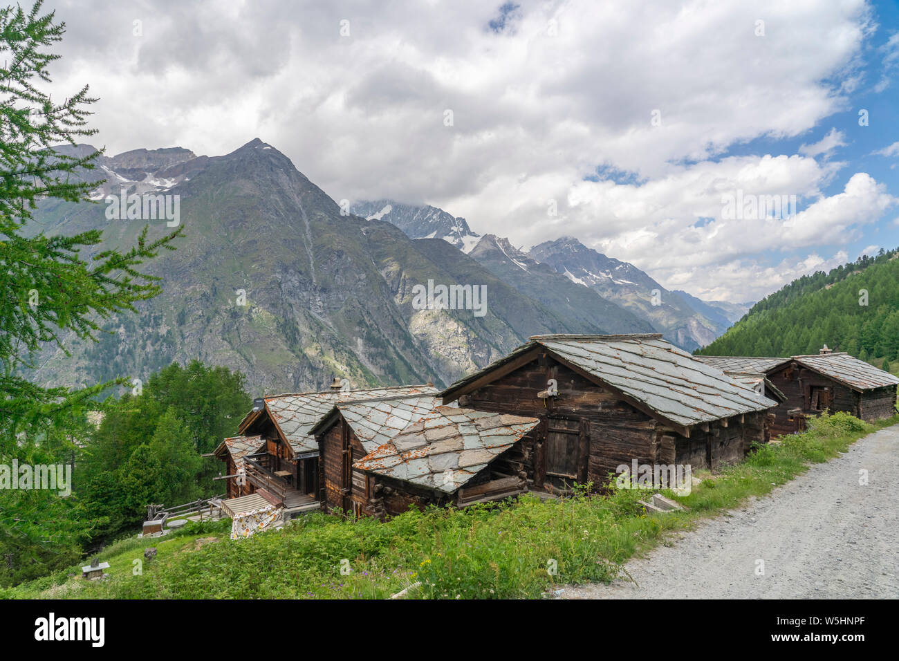 traditional wooden houses in the village of Taesch, high above Zermatt ...