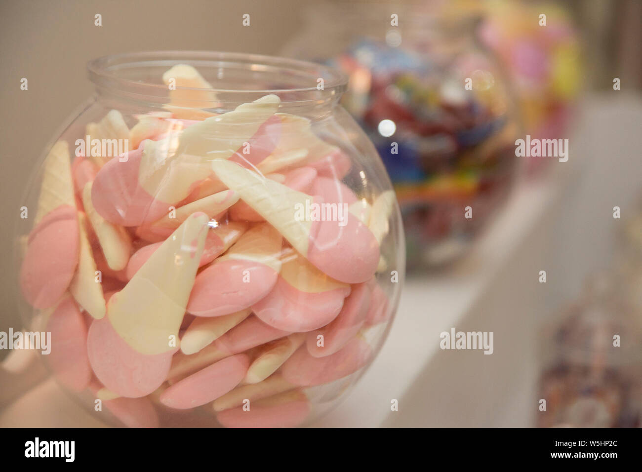 Bowls of sweets on a sweet cart at a wedding reception, waiting for the ...