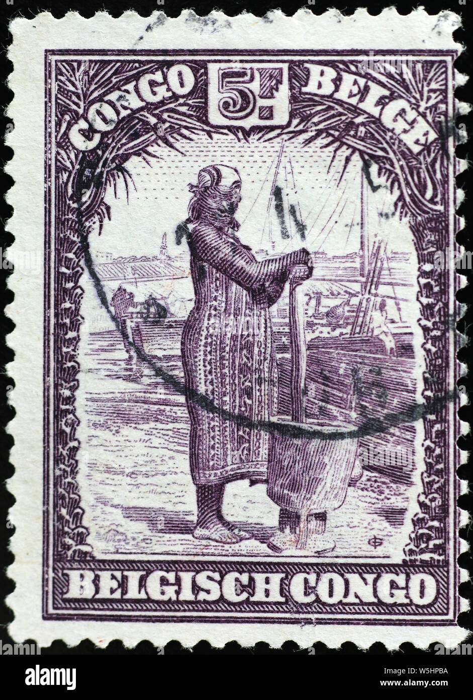 Woman working on vintage stamp of Belgian Congo Stock Photo - Alamy