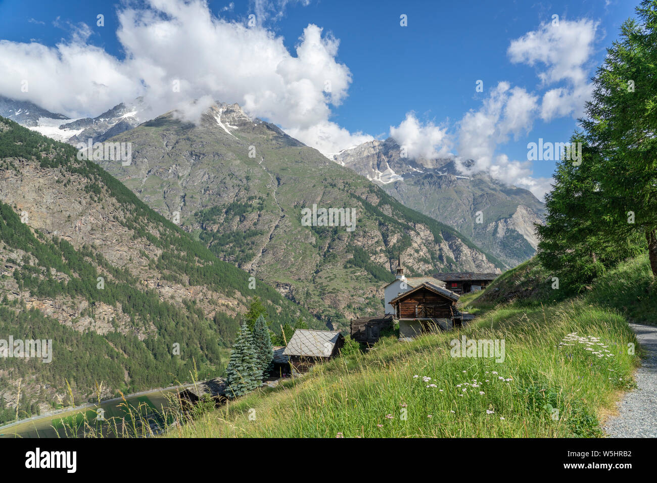 traditional wooden houses in the village of Taesch, high above Zermatt ...