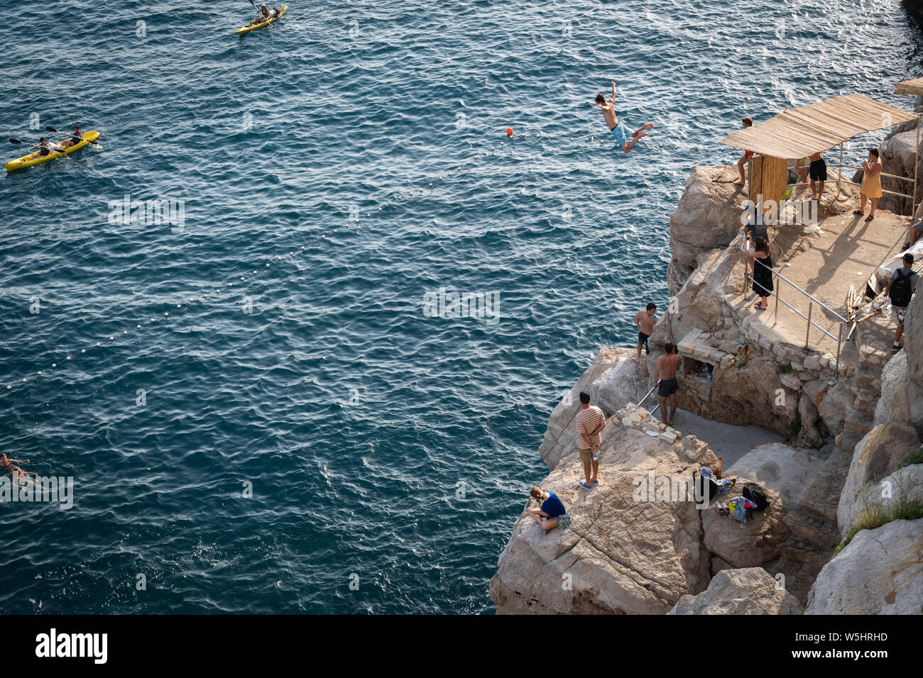 Swimming and Cliff diving from the City walls in Dubrovnik Stock Photo ...
