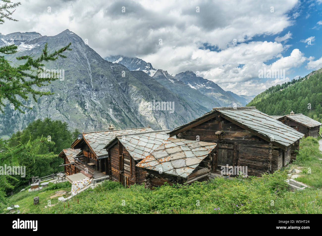 traditional wooden houses in the village of Taesch, high above Zermatt ...