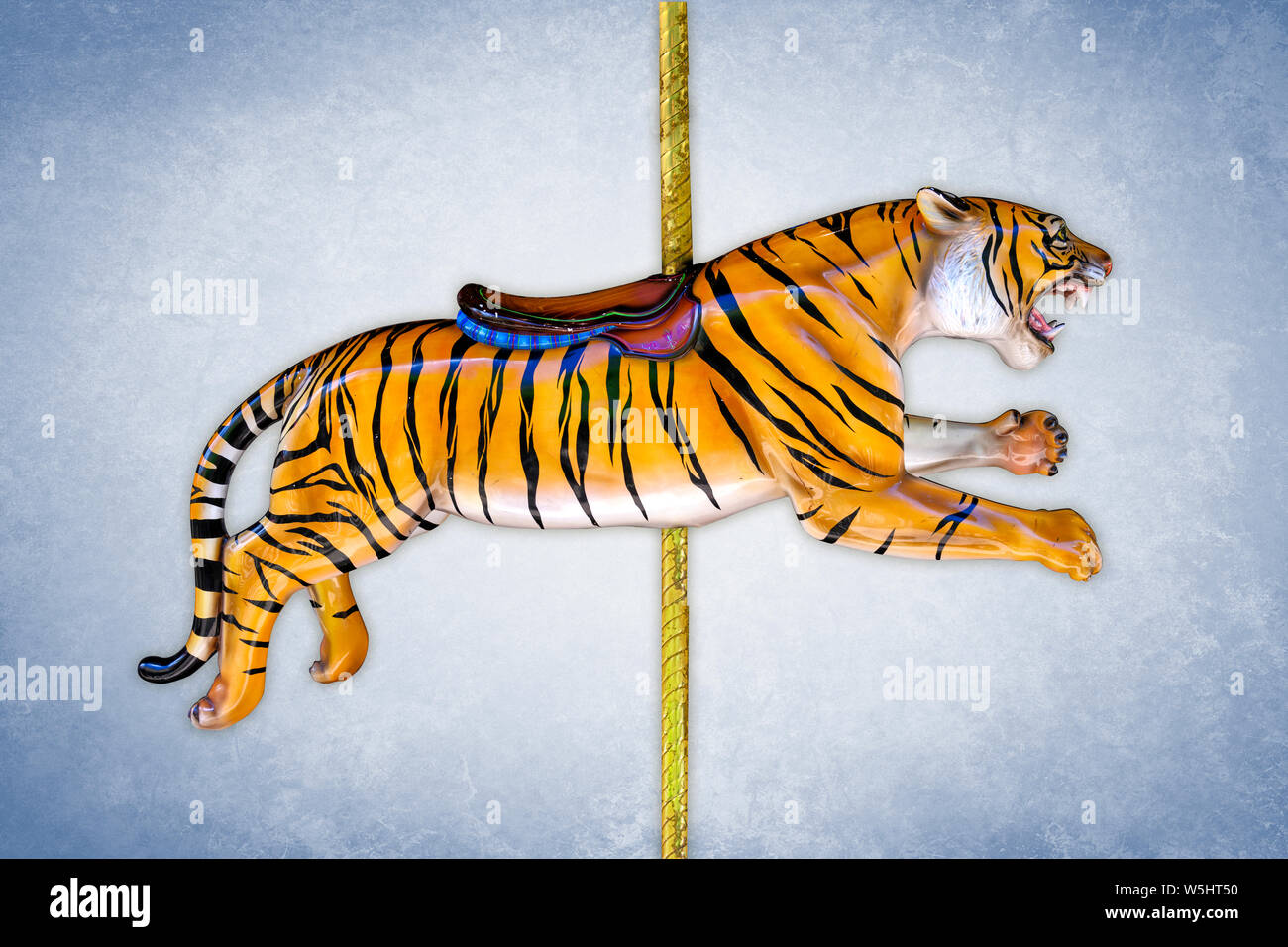 Carnival carousel tiger isolated on blue background Stock Photo - Alamy