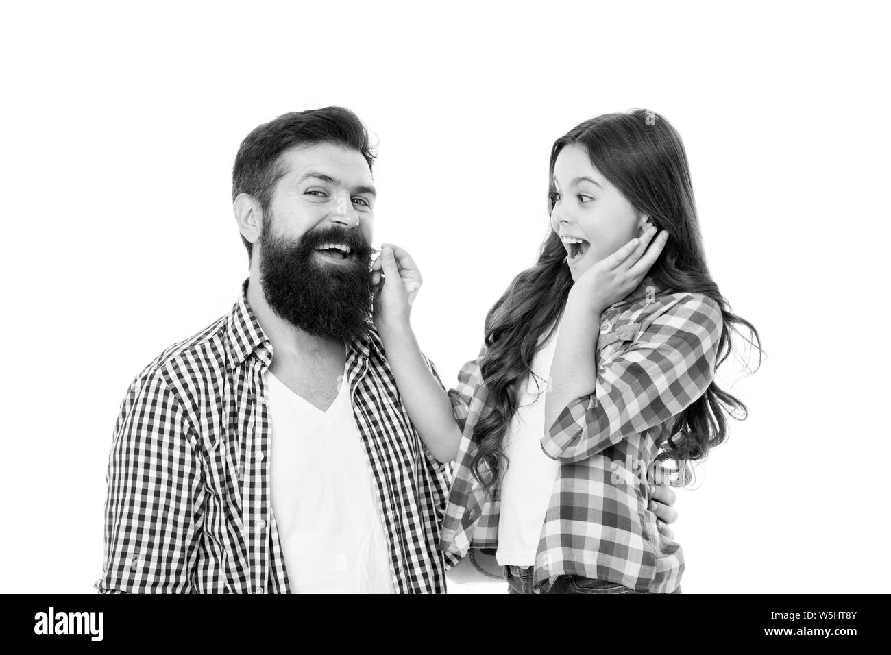 Only the best man can grow a beard. Little daughter touching beard of ...