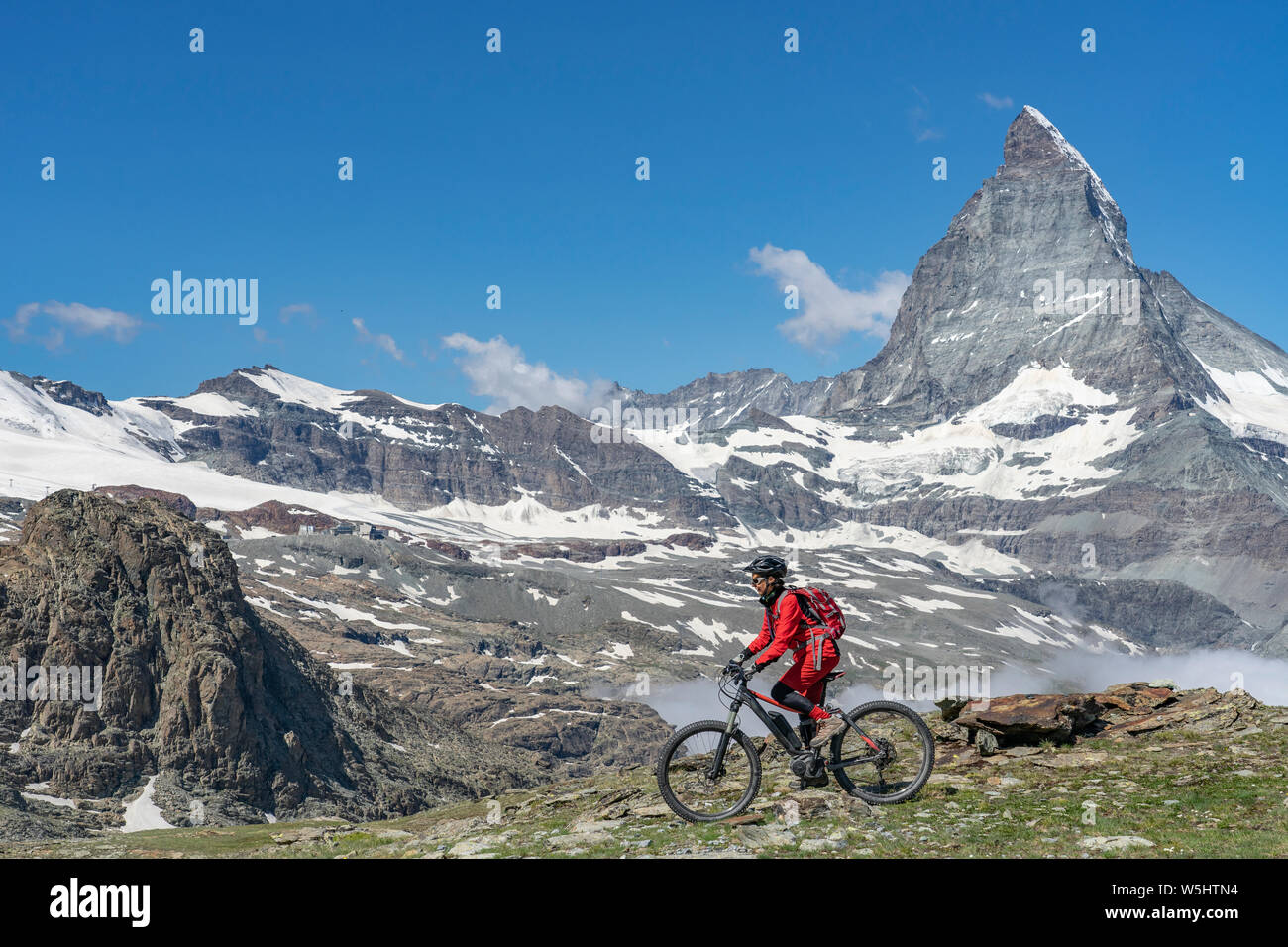 active-senior-woman-riding-her-electric-mountainbike-below-the-famous