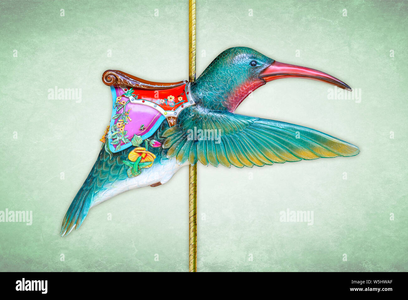 Carnival carousel hummingbird isolated on green background Stock Photo ...