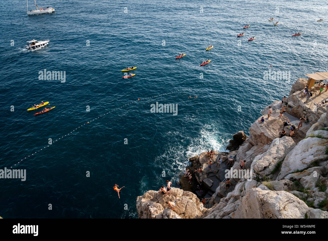 Swimming and Cliff diving from the City walls in Dubrovnik Stock Photo ...