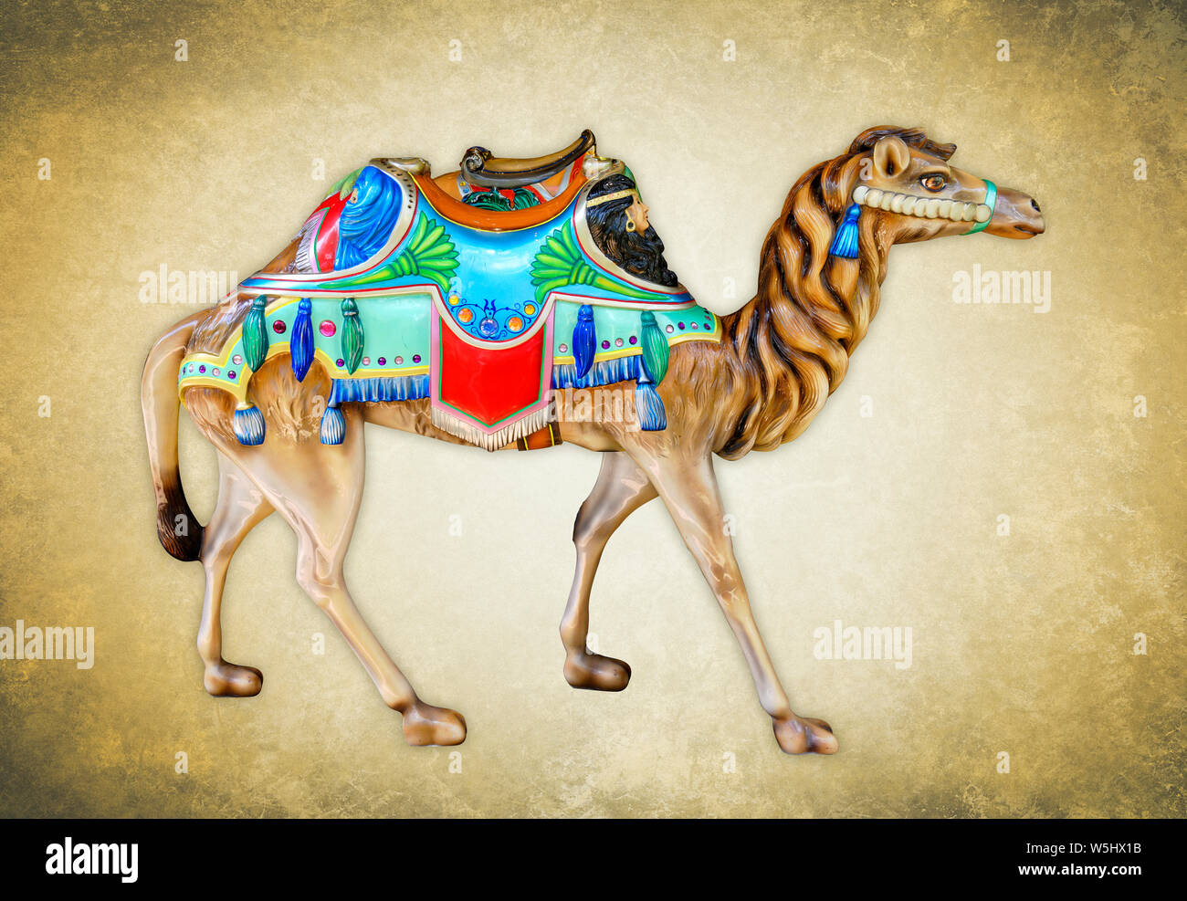 Carnival carousel camel isolated on gold background Stock Photo - Alamy