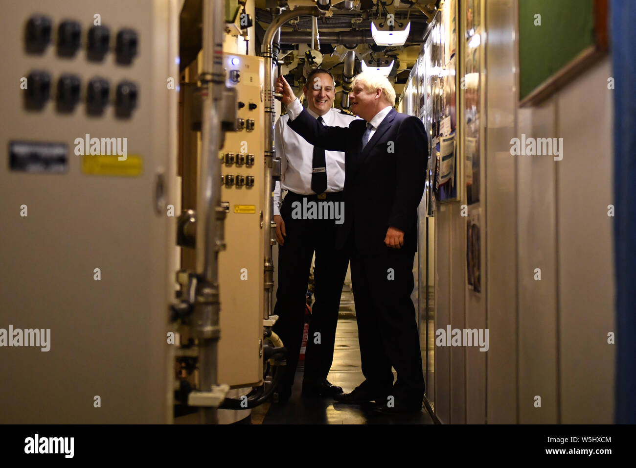 Prime Minister Boris Johnson visits HMS Victorious accompanied by ...