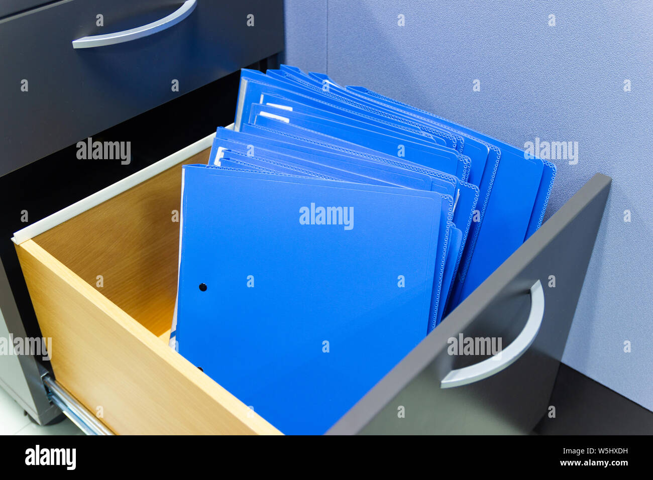 blue file folder documents In a file cabinet retention of contracts ...
