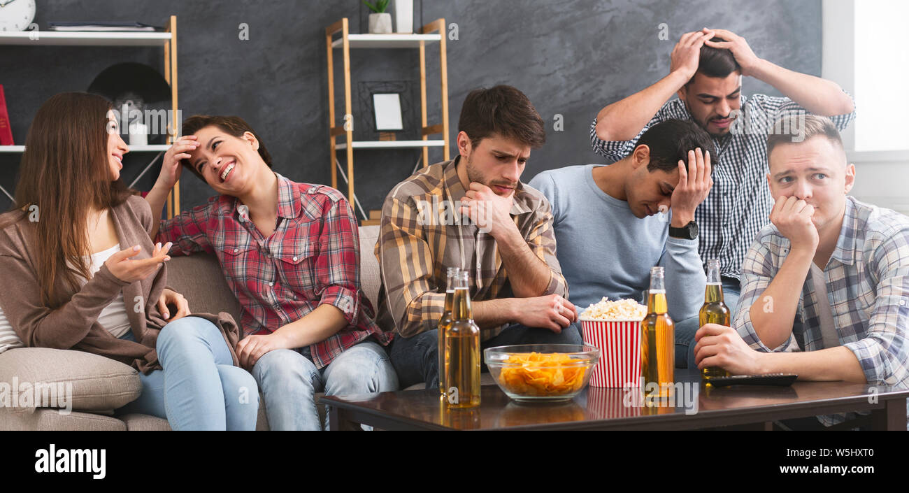 Four male friends frustrated after watching football game Stock Photo ...