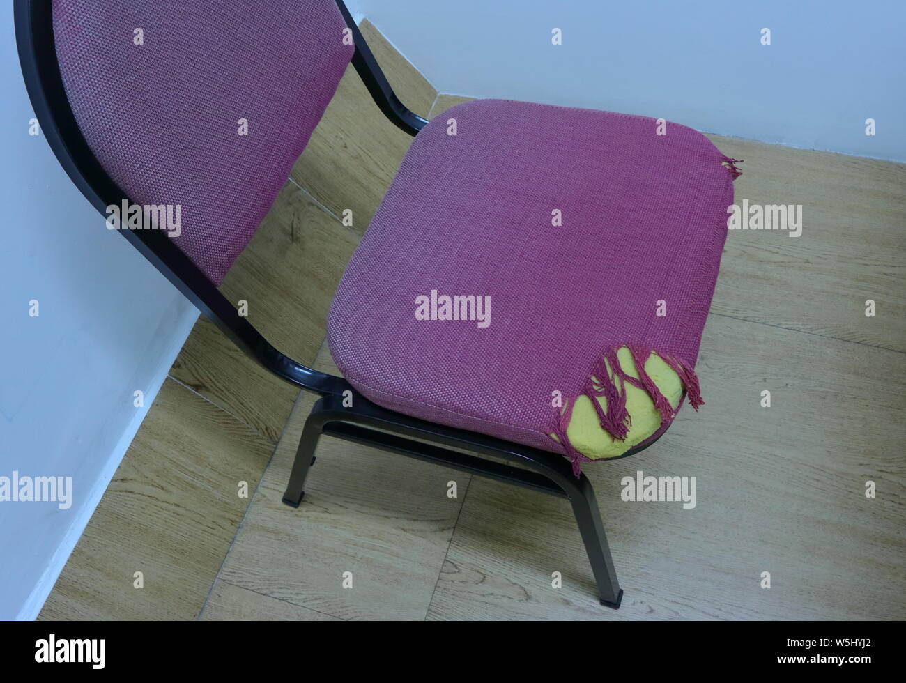A torn cloth chair, have seen better days concept Stock Photo - Alamy