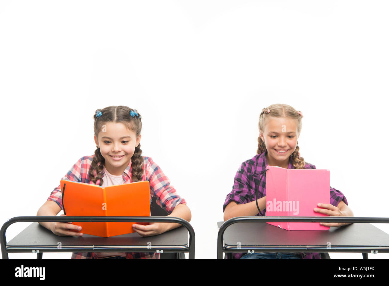 Reading opens doors. Small children reading books isolated on white ...