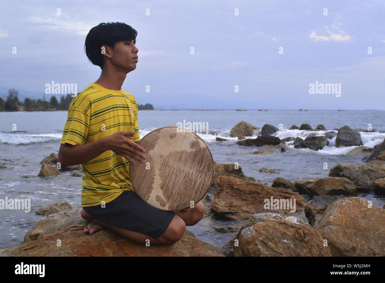 July 29, 2019, Susoh, aceh, Indonesia: A young man plays a traditional ...
