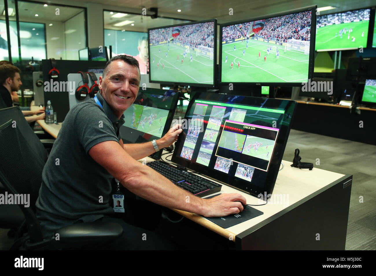 Former Premier League Referee Neil Swarbrick sits at a VAR station ...